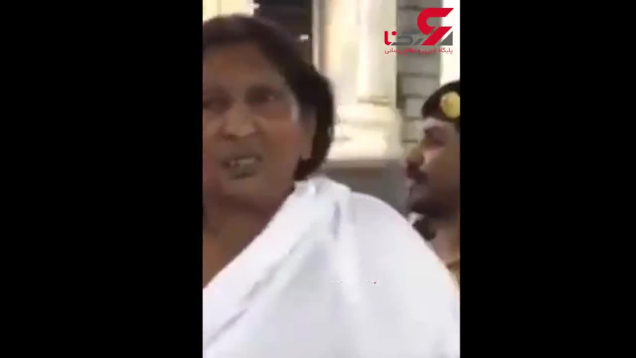 زن بیحجاب با لباس احرام مردانه در مقابل کعبه فیلم